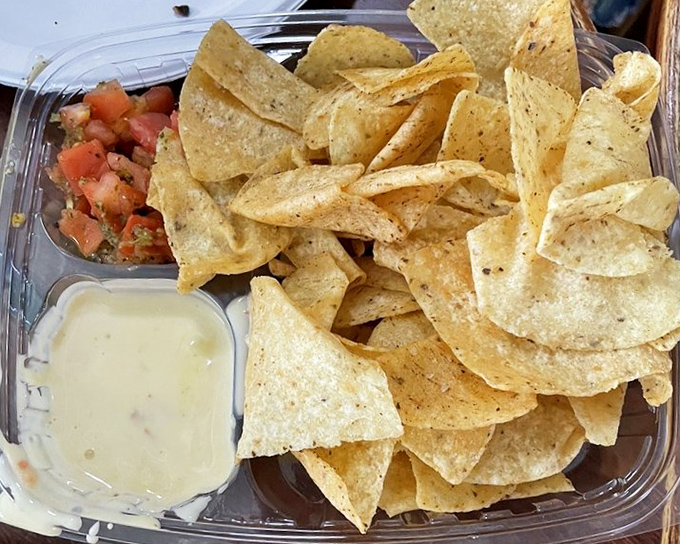 Simple pleasures: crispy tortilla chips, fresh salsa, and queso that stretches with each dip. Sometimes happiness really is this uncomplicated.