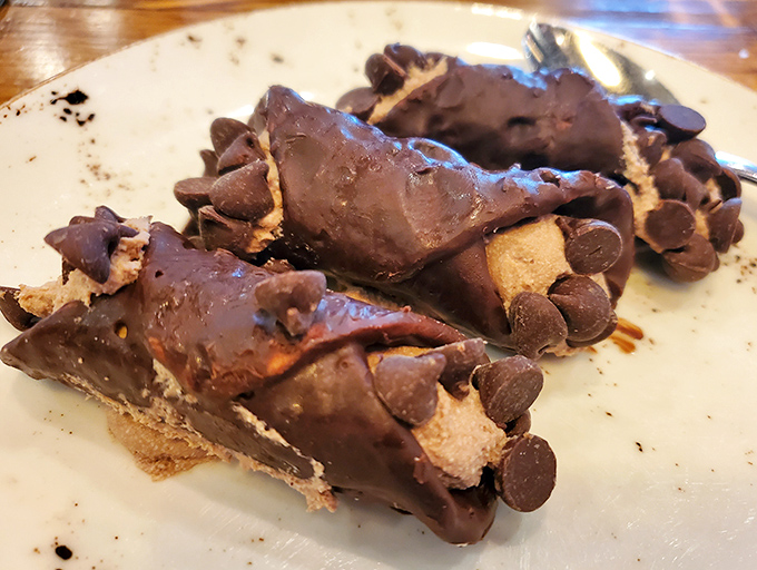 Chocolate cannoli that shatters with purpose, revealing a creamy interior studded with chocolate chips&mdash;Sicily's gift to your sweet tooth.