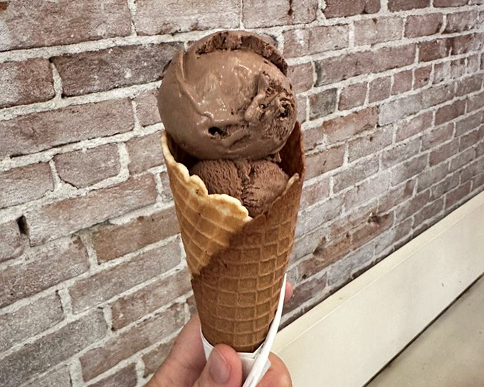 This chocolate gelato cone isn't just dessert&mdash;it's therapy in edible form, with the exposed brick providing the perfect Instagram backdrop.