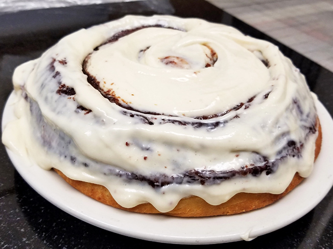 That cinnamon roll isn't just breakfast&mdash;it's a spiral galaxy of butter, sugar, and spice that makes you understand why people lined up for these before smartphones existed.
