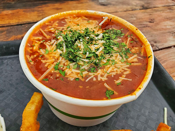 This cioppino isn't just soup; it's a vibrant tomato sea where herbs dance and seafood throws the party of the year.