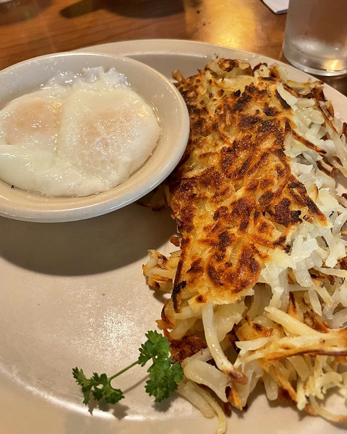 Hash browns that look like they've been kissed by the breakfast gods, sitting alongside eggs that remind you why simple food done right is life's greatest pleasure.