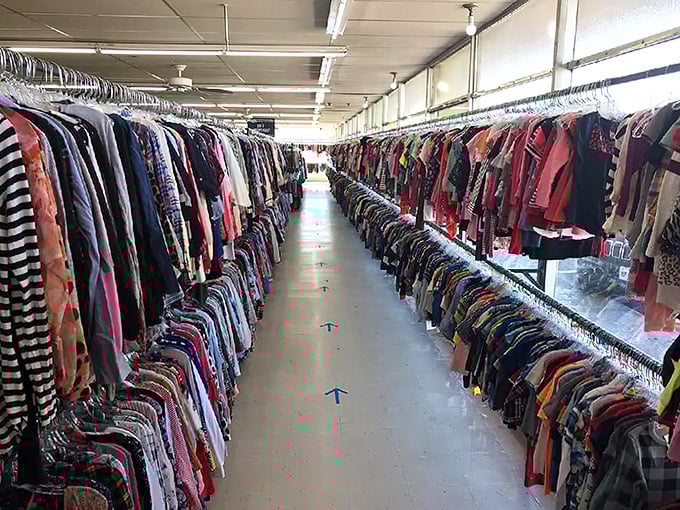 The clothing aisles stretch like runways of possibility, where yesterday's fashion choices await tomorrow's vintage enthusiasts.