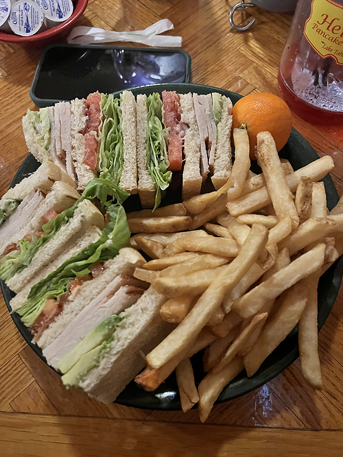 The club sandwich&mdash;proof that lunch at a breakfast joint isn't settling. Those perfectly stacked layers are architecture you can eat.