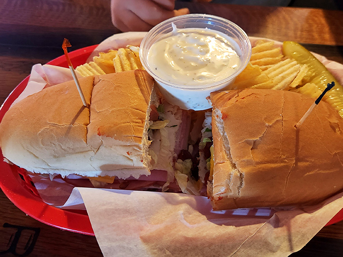 A sandwich that requires engineering to eat. Stacked high with layers of meat and cheese, it's the architectural marvel of lunch options. 