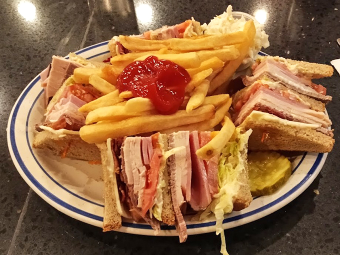 The club sandwich &ndash; architectural marvel of the diner world. Three stories of deliciousness that requires both hands and possibly a strategy meeting.