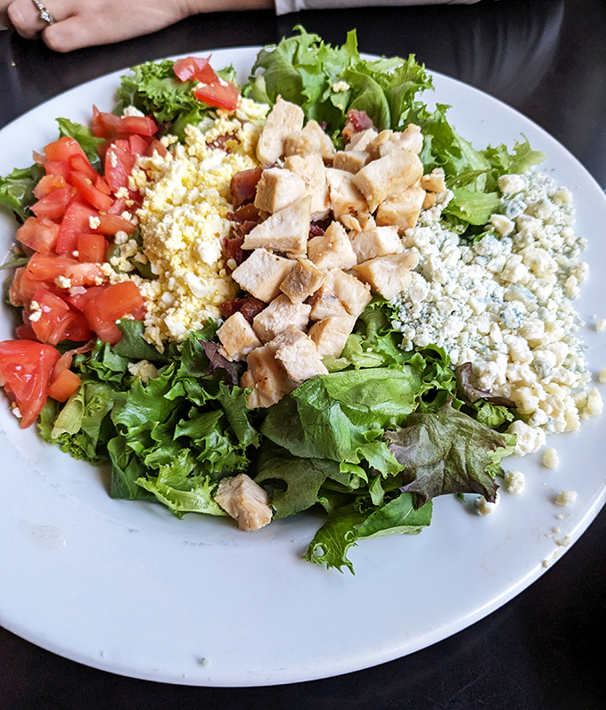 The Cobb salad arrives like edible artwork&mdash;a colorful arrangement of fresh ingredients that makes eating your vegetables feel like a reward, not a requirement.