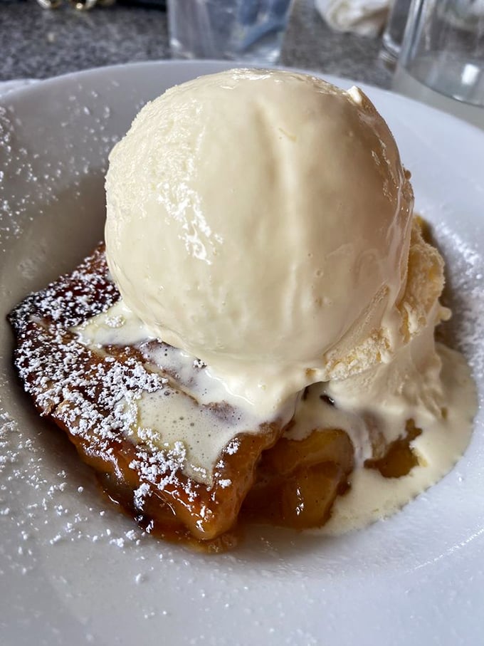 Dessert that makes you reconsider your life choices: warm cobbler supporting a melting scoop of vanilla ice cream in a beautiful relationship of hot and cold.