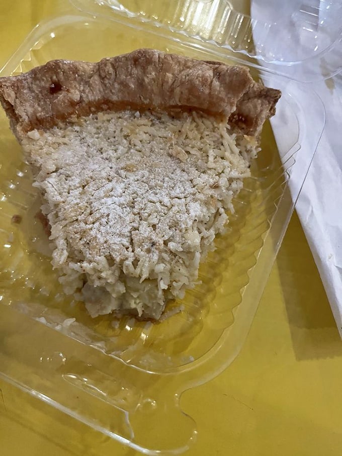 Coconut pie that looks like it came straight from grandma's kitchen. The crumbly top hides creamy coconut treasures beneath.