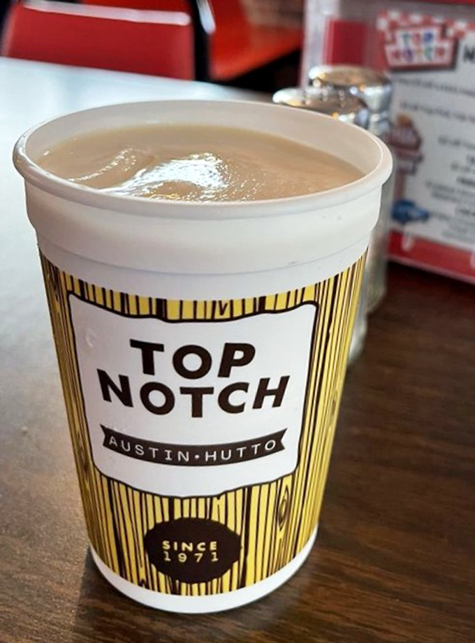 That striped cup isn't just holding a milkshake; it's cradling liquid nostalgia thick enough to require serious straw strength.