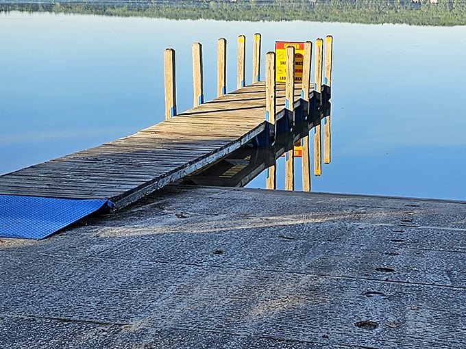 Where land meets lake in perfect harmony. This dock invites boats by day and contemplative stargazers by night.