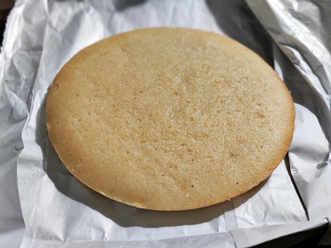 Cornbread so perfectly golden it deserves its own spot in Fort Knox. Simple, unadorned, and ready to soak up every last drop of barbecue sauce.