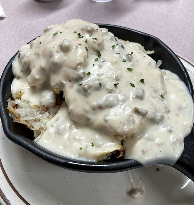 Country gravy doesn't just cover these potatoes, it embraces them like a warm hug from your favorite aunt who knows her way around comfort food.