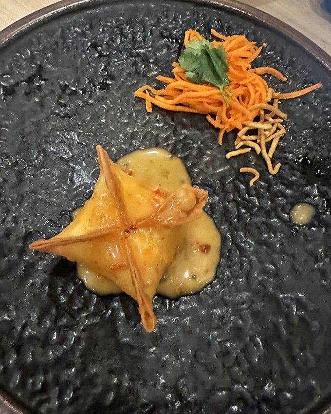 This crab rangoon isn't just fried&mdash;it's transformed into a golden pocket of creamy decadence that would make even the most dignified diner lick their fingers.