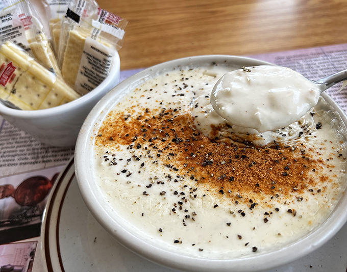 Cream of crab soup so rich it should have its own tax bracket, topped with a sprinkle of spice that whispers, "You're welcome."