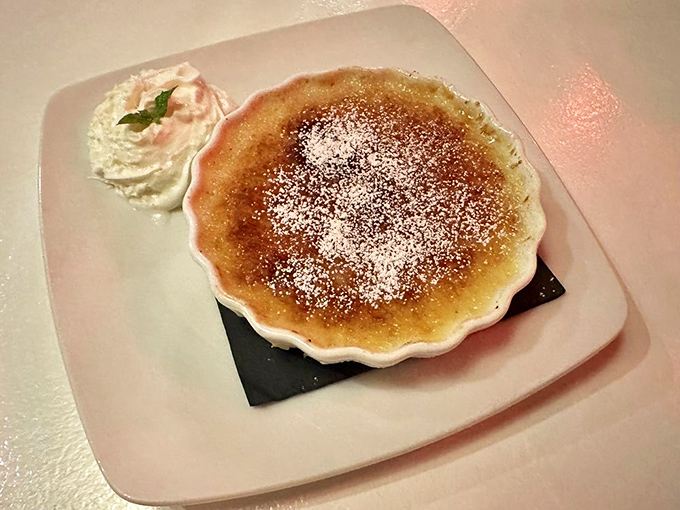 That caramelized sugar top cracks like thin ice on a winter pond, revealing creamy custard paradise beneath.