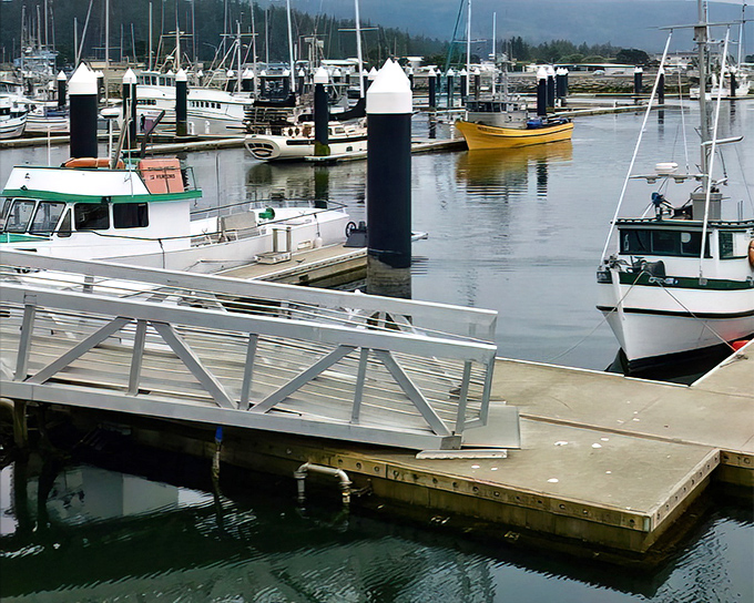 The harbor's fishing fleet rests between adventures, their colorful hulls promising tomorrow's fresh catch and today's waterfront photo opportunities.