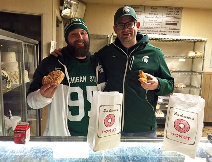 Sports rivalries disappear when donuts enter the equation &ndash; these Michigan State fans know that Schneider's treats transcend team loyalties.