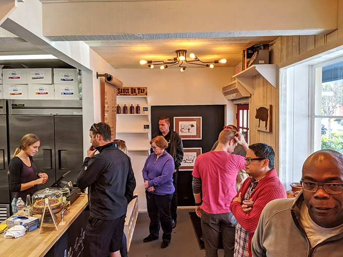 The line forms for a reason. These barbecue pilgrims know that good things come to those who wait (and those who arrive early).