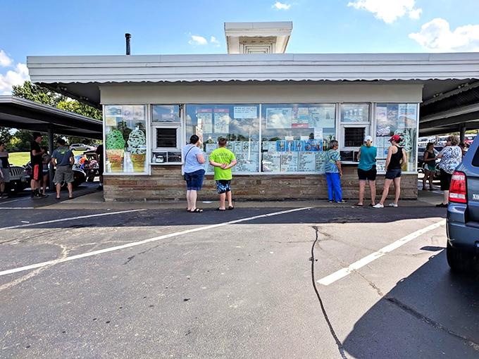 The service window becomes a community gathering spot where generations of Dalton residents have ordered their favorite summer treats.