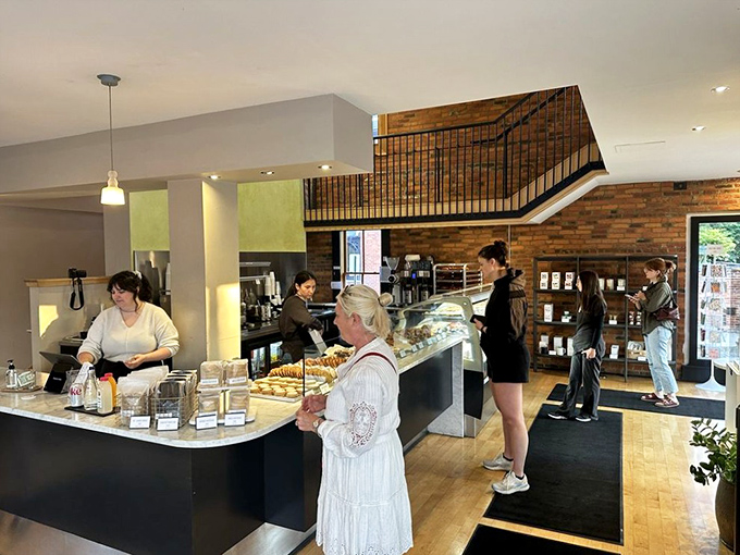 The bakery hums with the quiet energy of people united in pursuit of the perfect pastry experience.