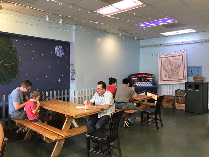 The indoor picnic tables create a nostalgic backdrop for families making memories one spoonful at a time.