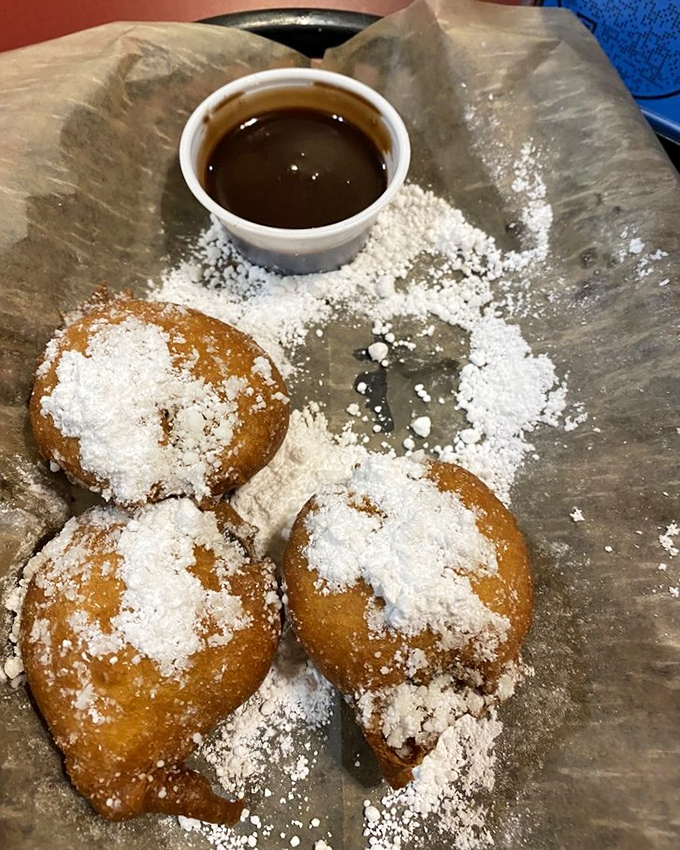 Deep-fried Oreos dusted with powdered sugar&mdash;because sometimes dessert needs to dress up for the occasion. Dipping sauce included for overachievers.