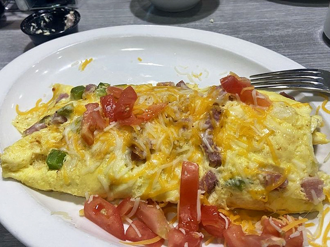 An omelet that's basically a Denver skyline in breakfast form &ndash; peaks of melted cheese, valleys of ham, and a sunrise of perfectly cooked eggs.