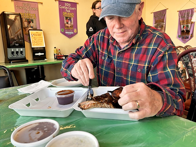 The look of a man who knows he's about to experience something transcendent. That sauce cup holds liquid gold that's been perfected over countless smoking sessions.