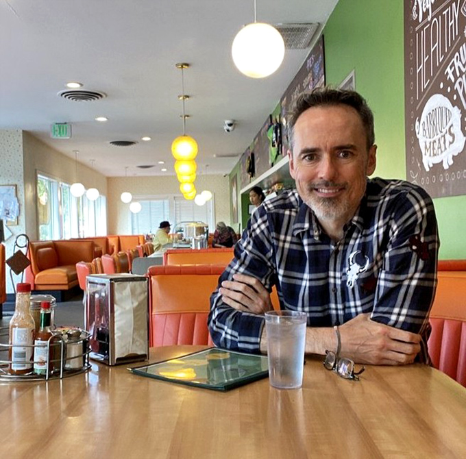The diner experience isn't complete without a friendly face across the table. Those orange booths have witnessed first dates, family celebrations, and everyday moments.