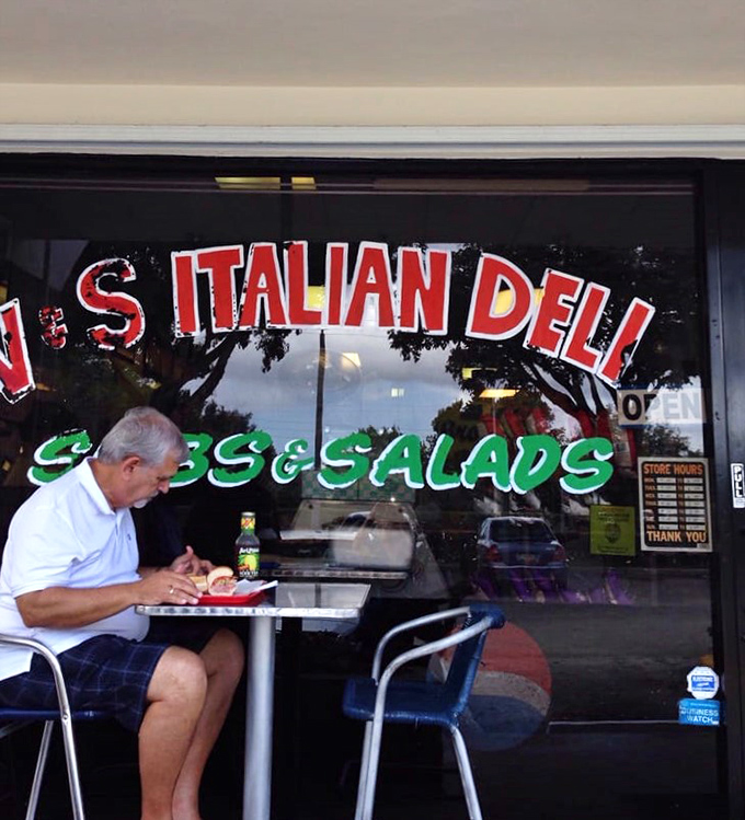 The outdoor seating area proves that sometimes the best dining rooms have no walls, just Florida sunshine and the anticipation of sandwich perfection.