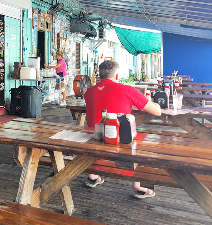 Picnic tables and condiment caddies set the stage for a no-pretense feast where flip-flops are the preferred footwear and napkins are absolutely necessary.