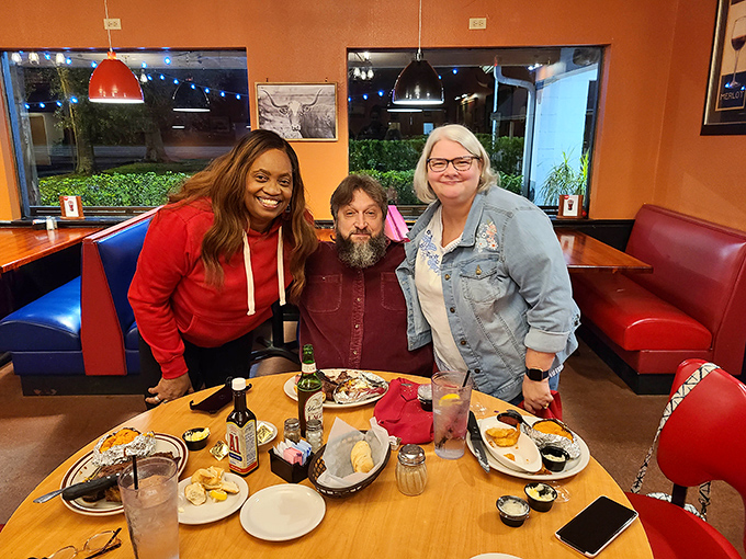 Happy diners gathered around a table loaded with promise&mdash;proof that good food creates better conversations and lasting memories.