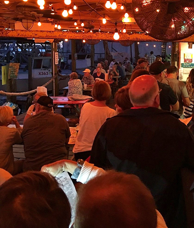 The evening rush at Star Fish Company. Strings of lights, the murmur of satisfied diners, and the promise of seafood worth waiting for.