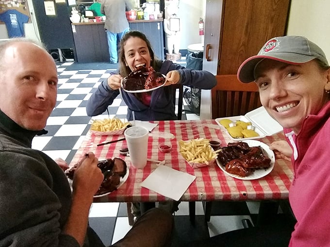 The universal language of barbecue brings people together. Those smiles say more than words ever could about what's on those plates.