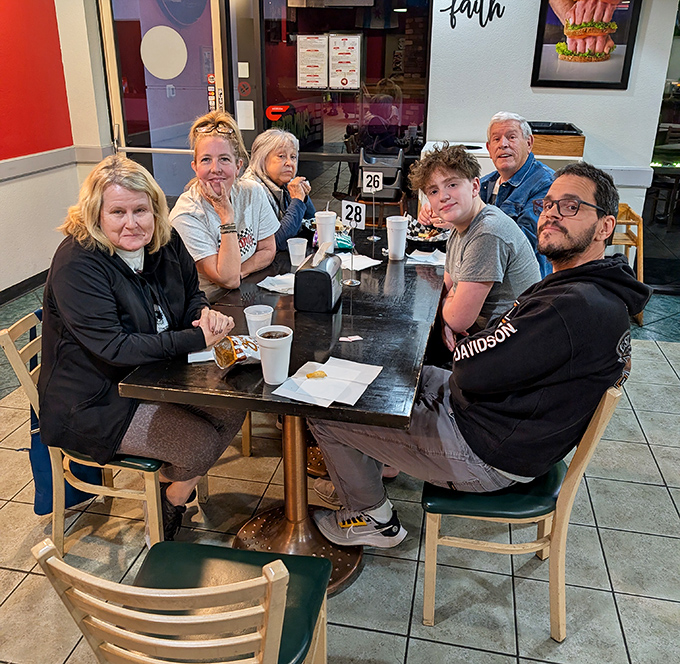 The true measure of a great local spot: tables filled with people who look like they've been coming here since before you knew what a good sandwich was.