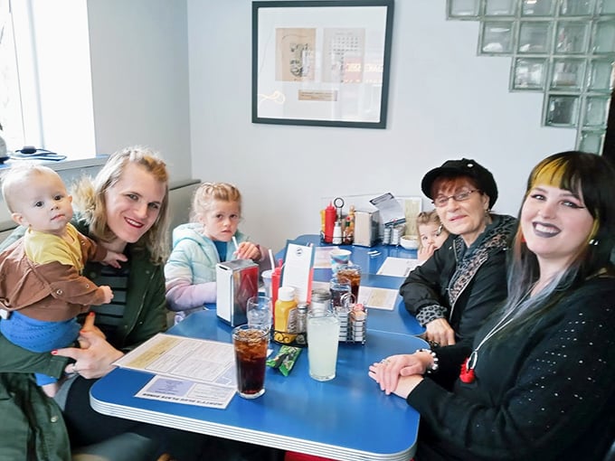 Family gatherings around blue tables—where memories are made between bites of pancakes and sips of milkshakes.
