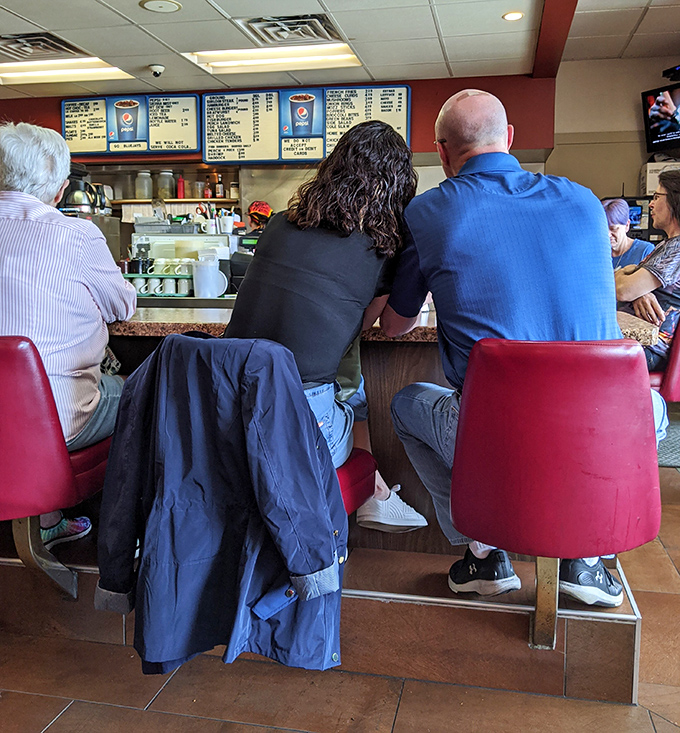 The counter seats&mdash;where regulars become family and first-timers become regulars after just one perfectly charred burger experience.