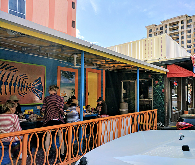 Happy diners proving that good food creates the best kind of community gathering spot.