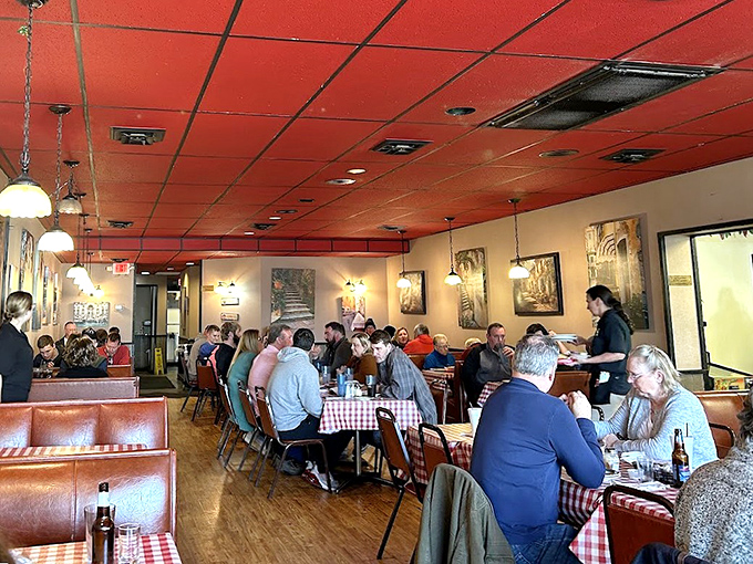 The dining room buzzes with conversation and clinking glasses. These aren't tourists &ndash; these are regulars who measure their lives in Giovanni's meals.