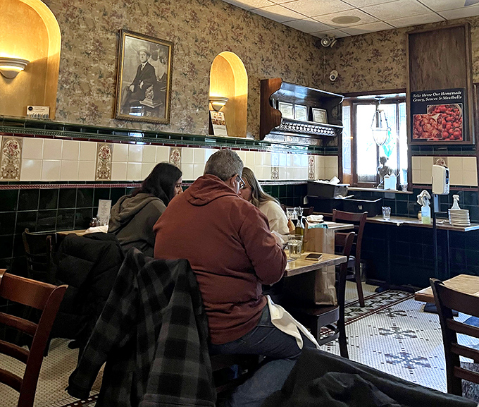 Every table tells a story. Diners lost in conversation and pasta create the soundtrack of authentic Italian dining experience.