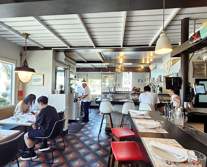 The dining room buzzes with the energy of people having exactly the meal they hoped for. Notice the perfectly spaced tables&mdash;they understand personal space here.