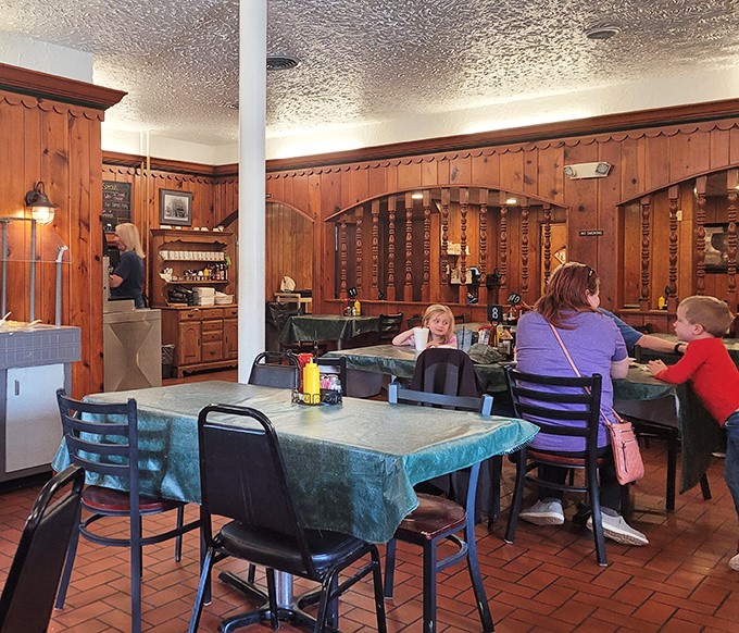 Families gather around tables where generations before them have broken bread, creating new memories in a space where time seems wonderfully suspended.