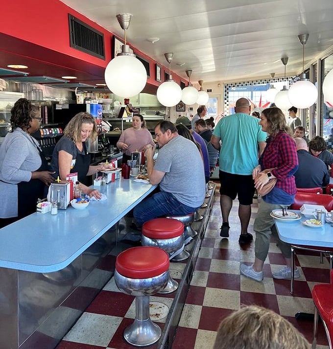 The breakfast rush &ndash; where strangers become temporary neighbors united by the universal language of "pass the syrup, please."