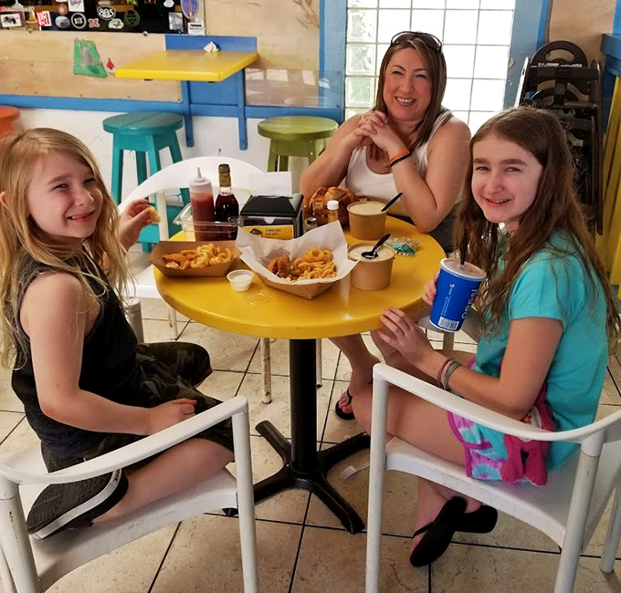 Family memories being made one bite at a time. These smiles? They're the universal language of "we ordered exactly right."