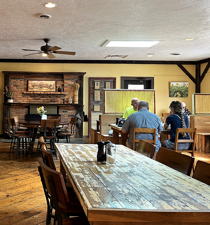 The dining room hums with conversation around weathered wooden tables that have hosted countless memorable meals and "remember when" moments.