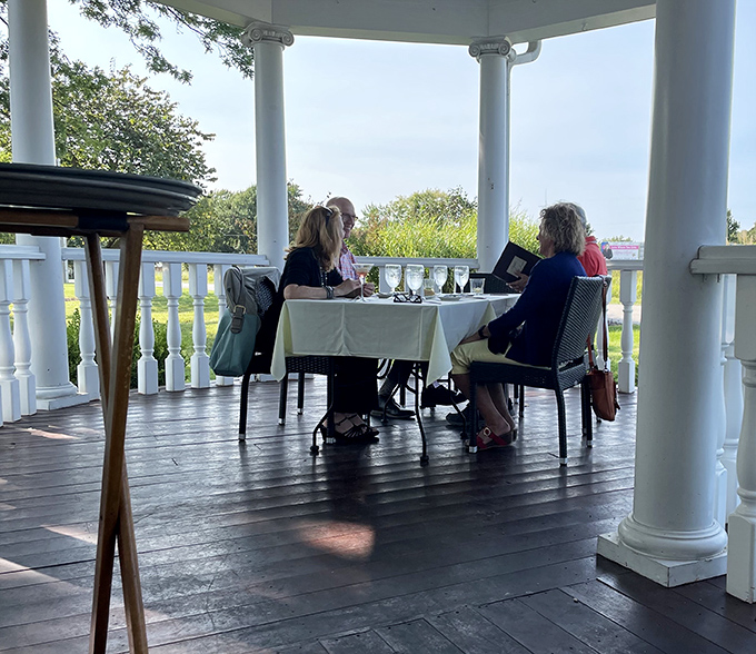 The wraparound porch dining experience&mdash;where fresh air and fine dining meet. Missouri countryside views complement every bite.