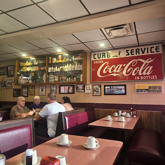 Where regulars become family and first-timers become regulars. That vintage Coca-Cola sign has witnessed more local gossip than any therapist in town.