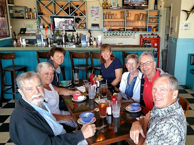 The true measure of a great local spot: tables filled with happy diners sharing stories over plates that will soon be spotlessly clean.