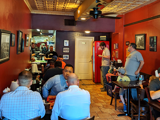 The lunch rush at Mike's &ndash; a diverse crowd united by the universal language of "mmm" and "pass the napkins, please."
